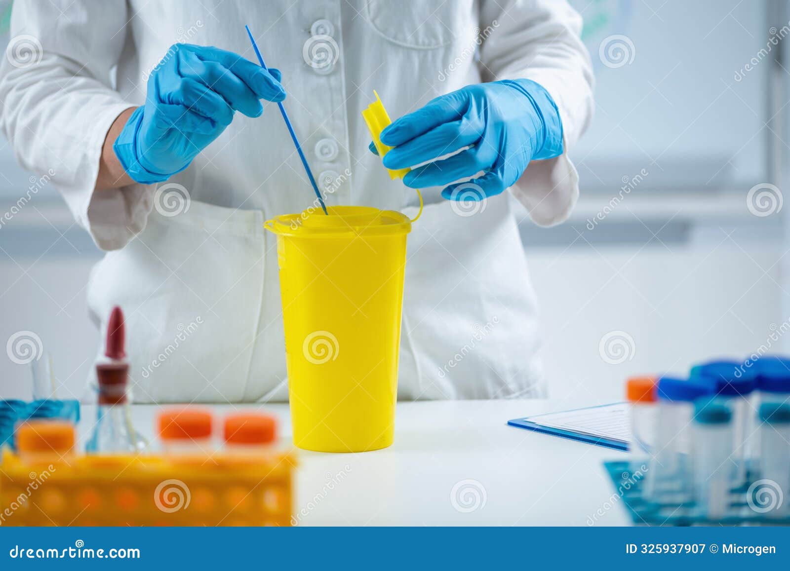 Disposing of Laboratory Consumables in Hazardous Waste Container Stock ...