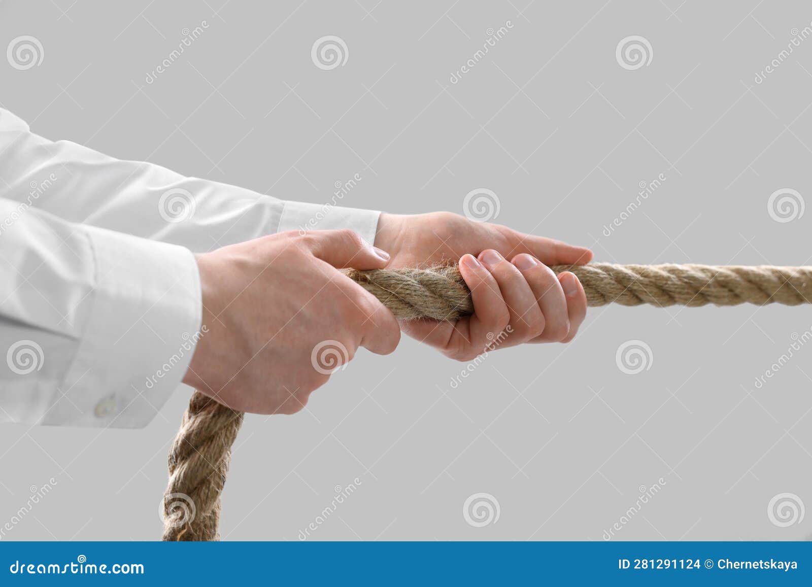 Dispute Concept. Man Pulling Rope on Light Grey Background, Closeup ...