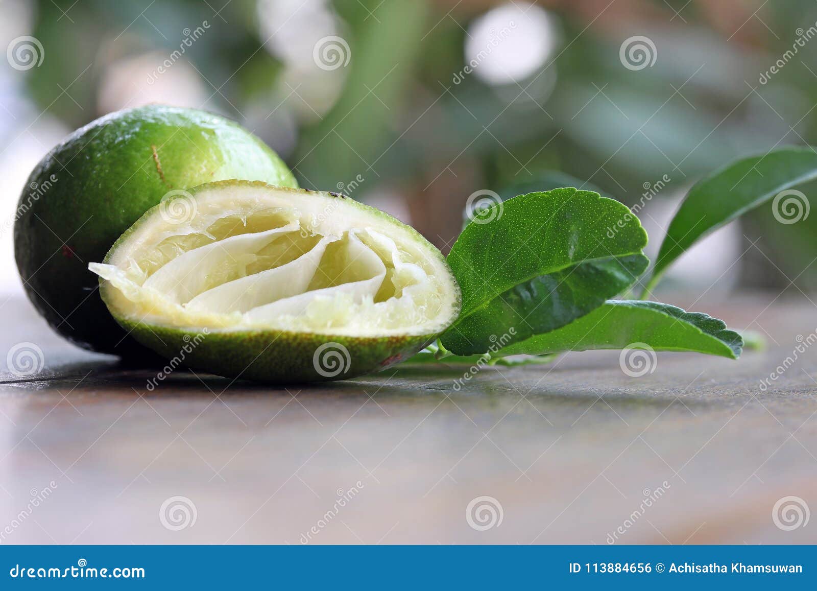 Dissect Lime is Squeeze Out with Full Lime and the Leafs on the Wooden ...