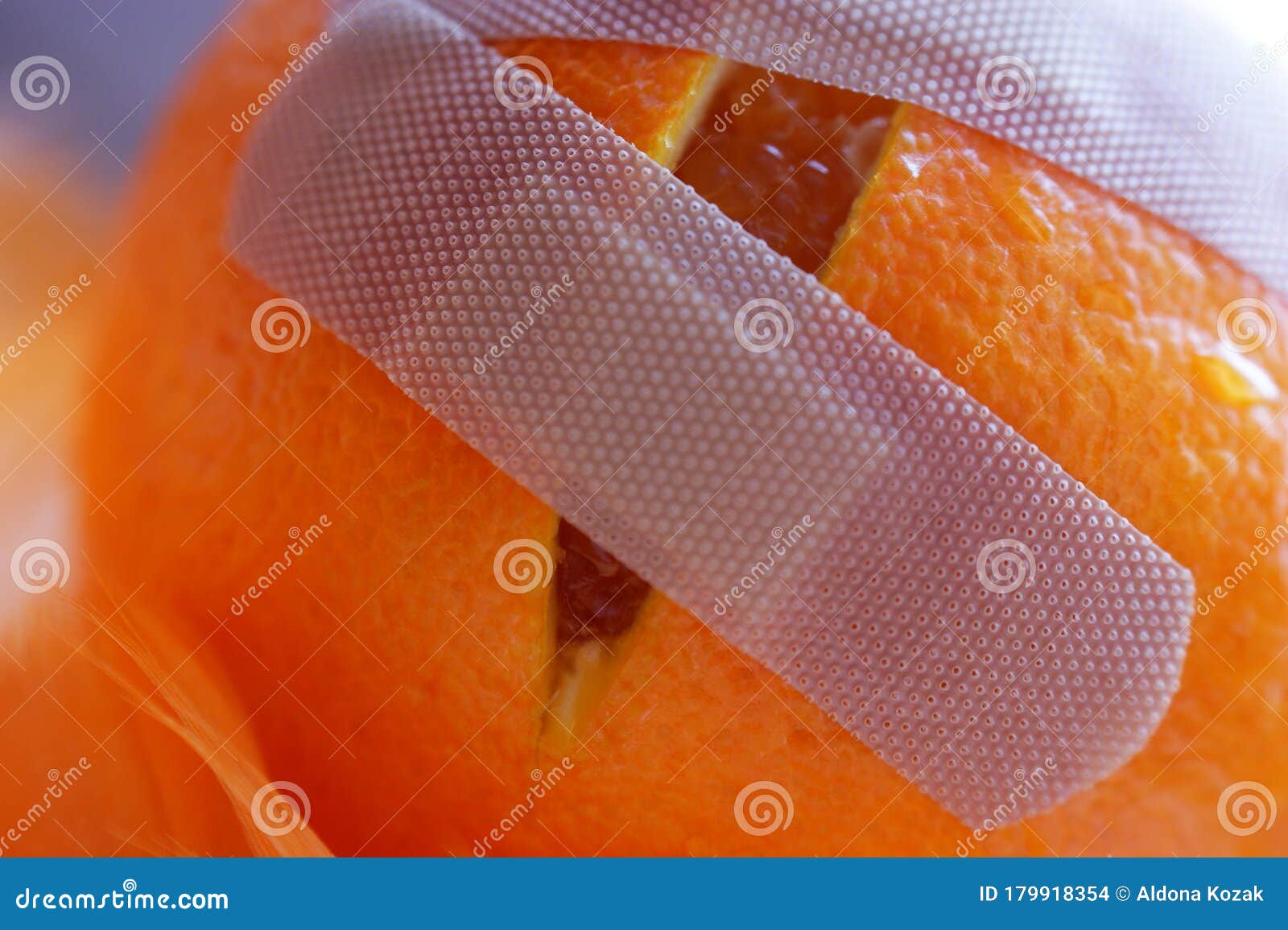 Dissected Damaged Cut Orange Stuck with a Plaster and Dressing Stock ...