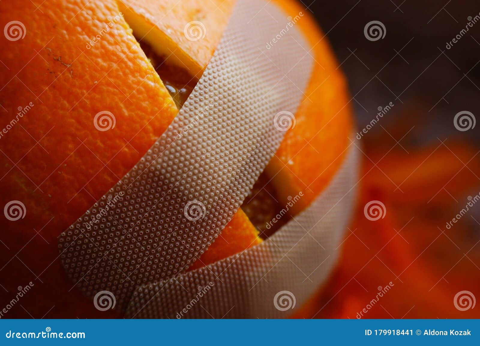 Dissected Damaged Cut Orange Stuck with a Plaster and Dressing Stock ...