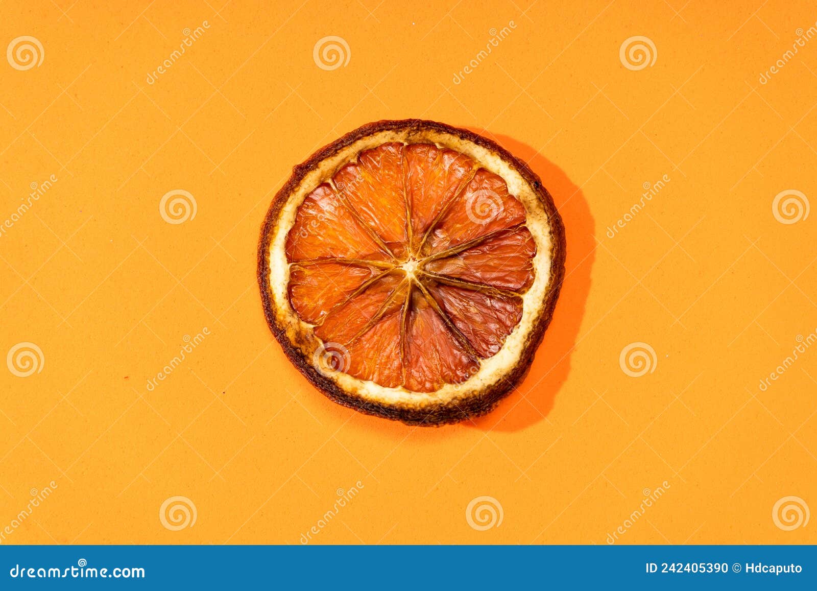 Dissected Orange Slice on a Orange Surface Stock Photo - Image of ...