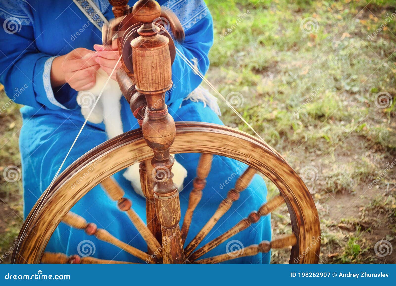 Hand Spinning Wheel On The Wall Of The Old Log House Royalty-Free Stock ...