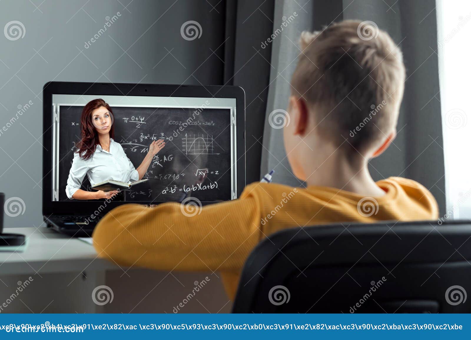 Distance Learning, a Boy Learns Math while Looking at a Laptop Beech ...
