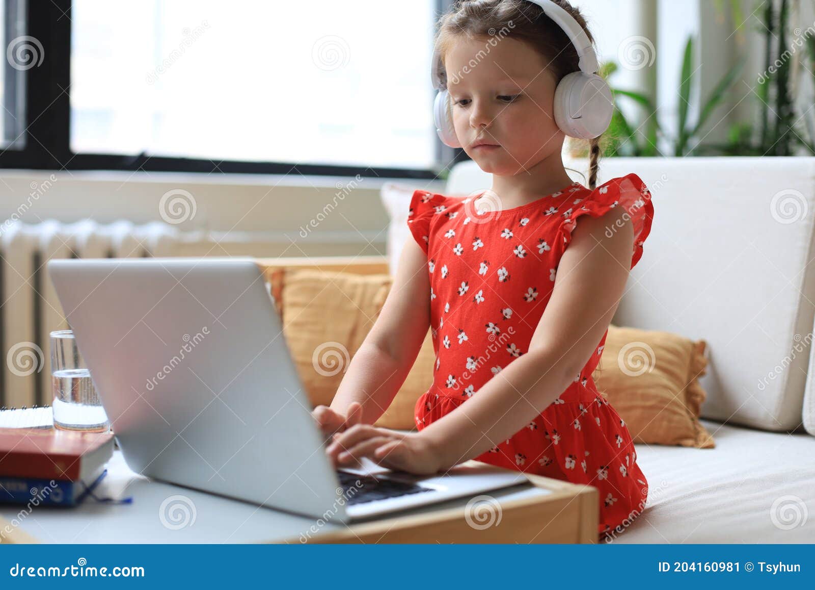Distance Learning. Cheerful Little Girl Using Laptop Computer Studying ...