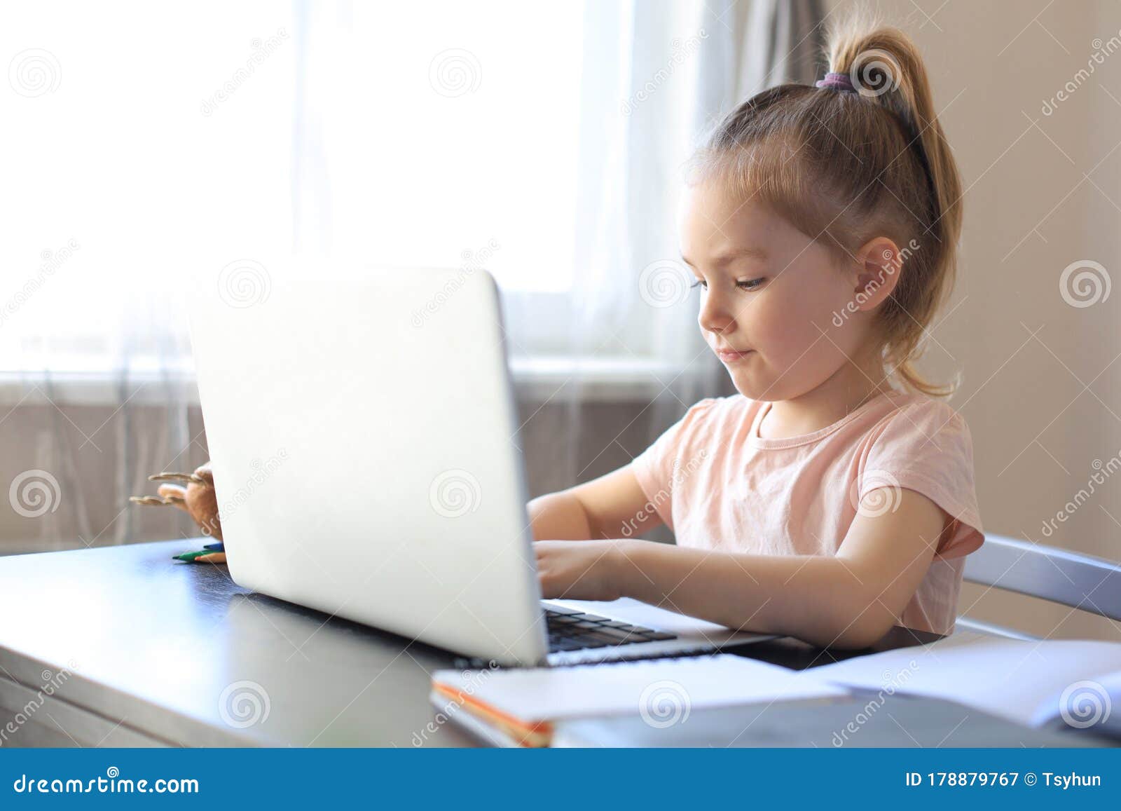 Distance Learning. Cheerful Little Girl Using Laptop Computer Studying ...