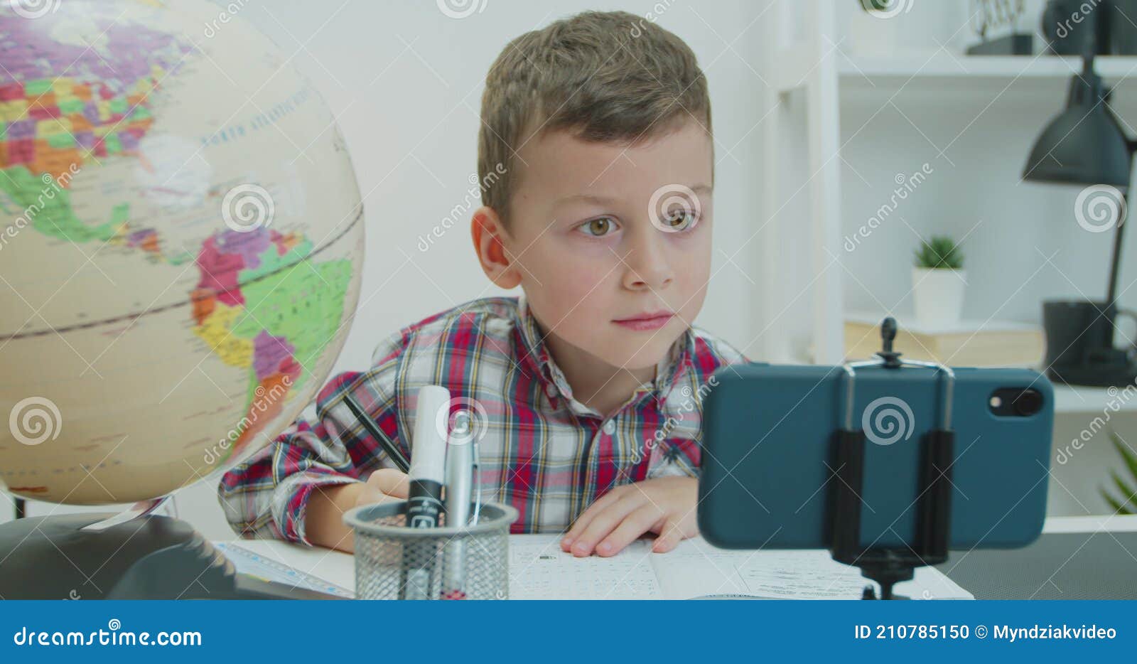 Distance Learning Concept. Schoolboy Studying Online Using Smartphone ...