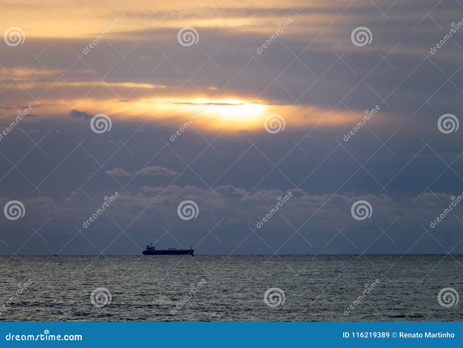 Distant Cargo Ship 3 stock image. Image of horizon, solitude - 116219389
