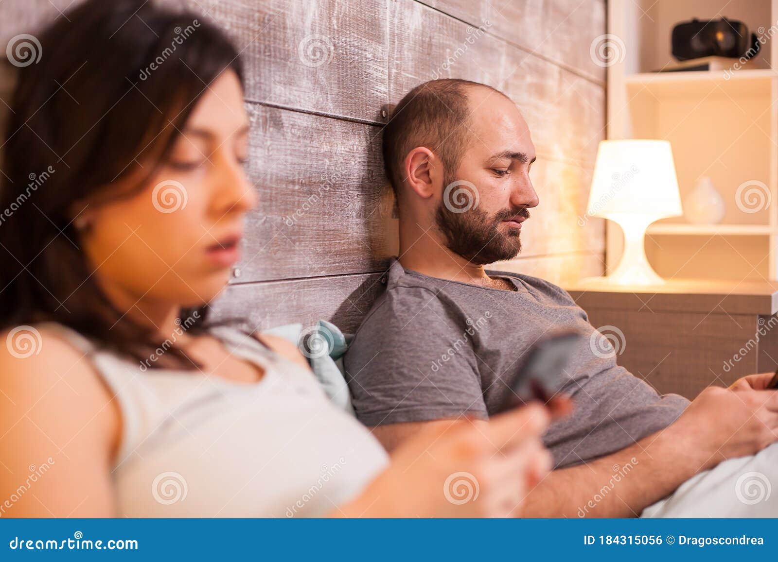 Distant Couple in Bed before Bedtime Stock Photo - Image of marriage ...
