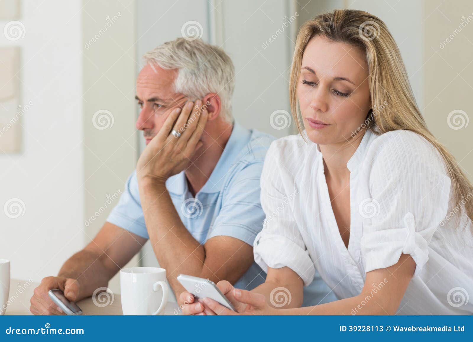 Distant Couple Sitting at the Counter Texting Stock Image - Image of ...