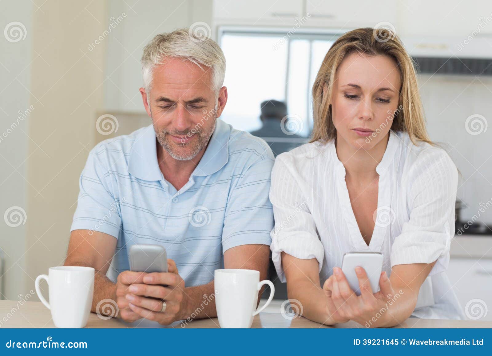 Distant Couple Sitting at the Counter Texting and Not Talking Stock ...