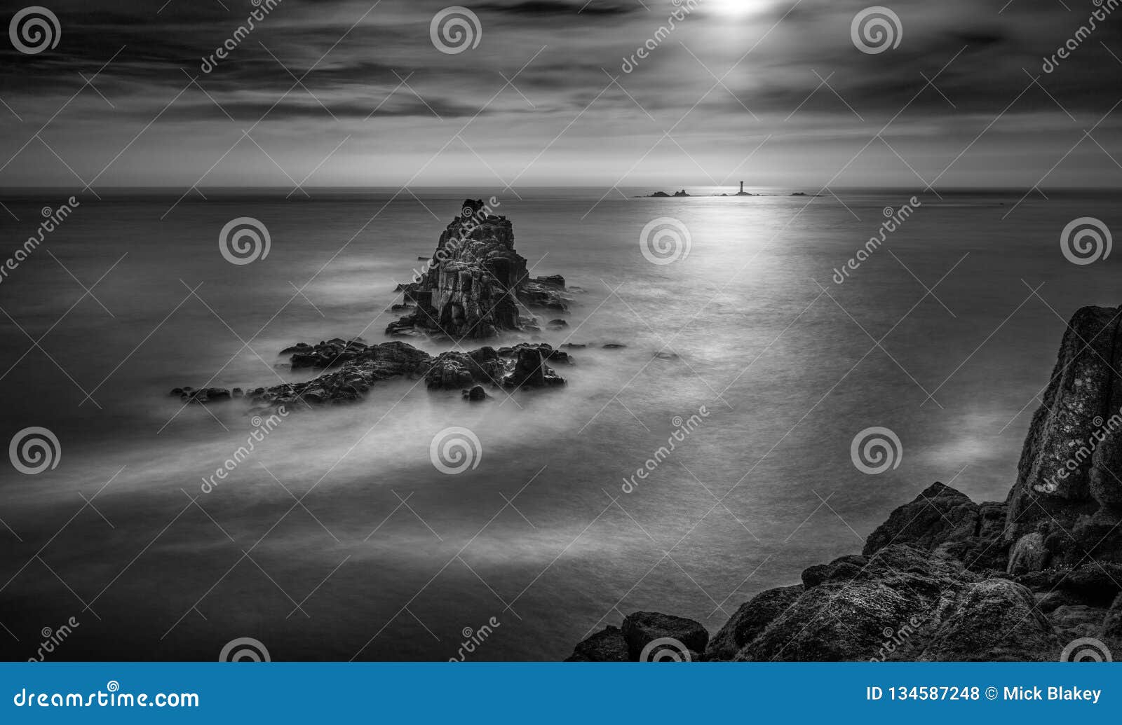 Distant Lighthouse, Lands End, West Cornwall, UK Stock Photo - Image of ...