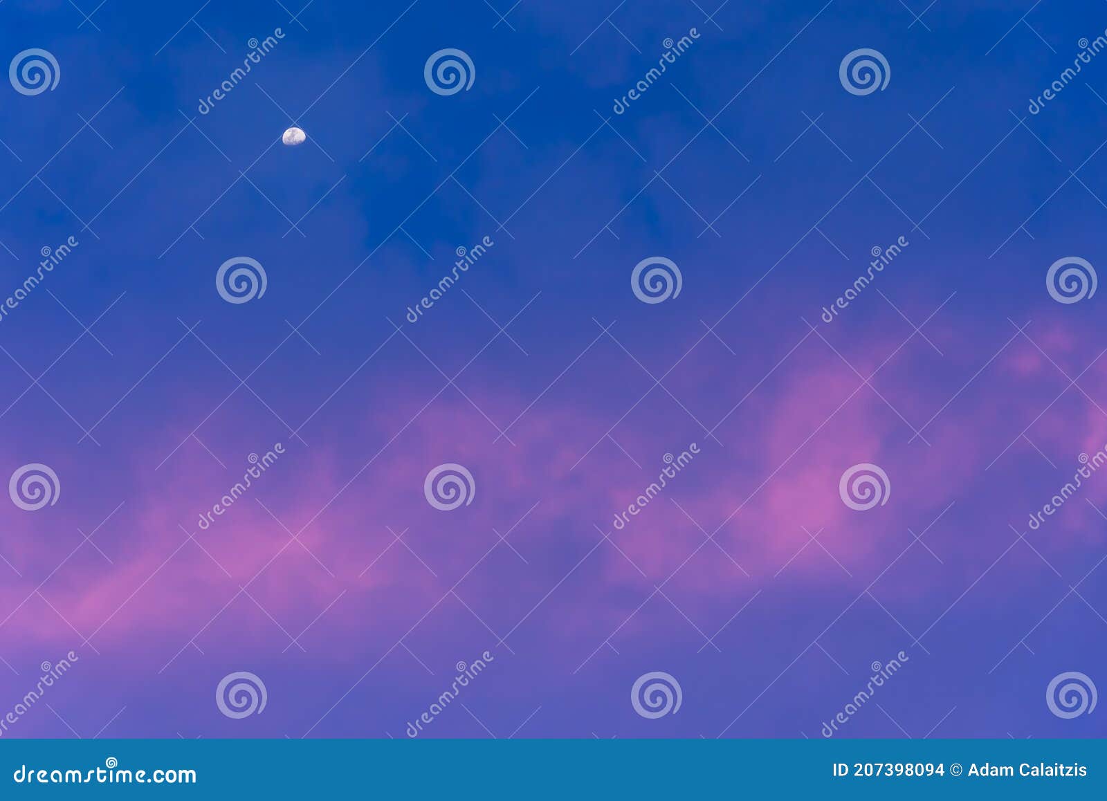 A Distant Moon in the Early Evening Sky Stock Photo - Image of cloud ...