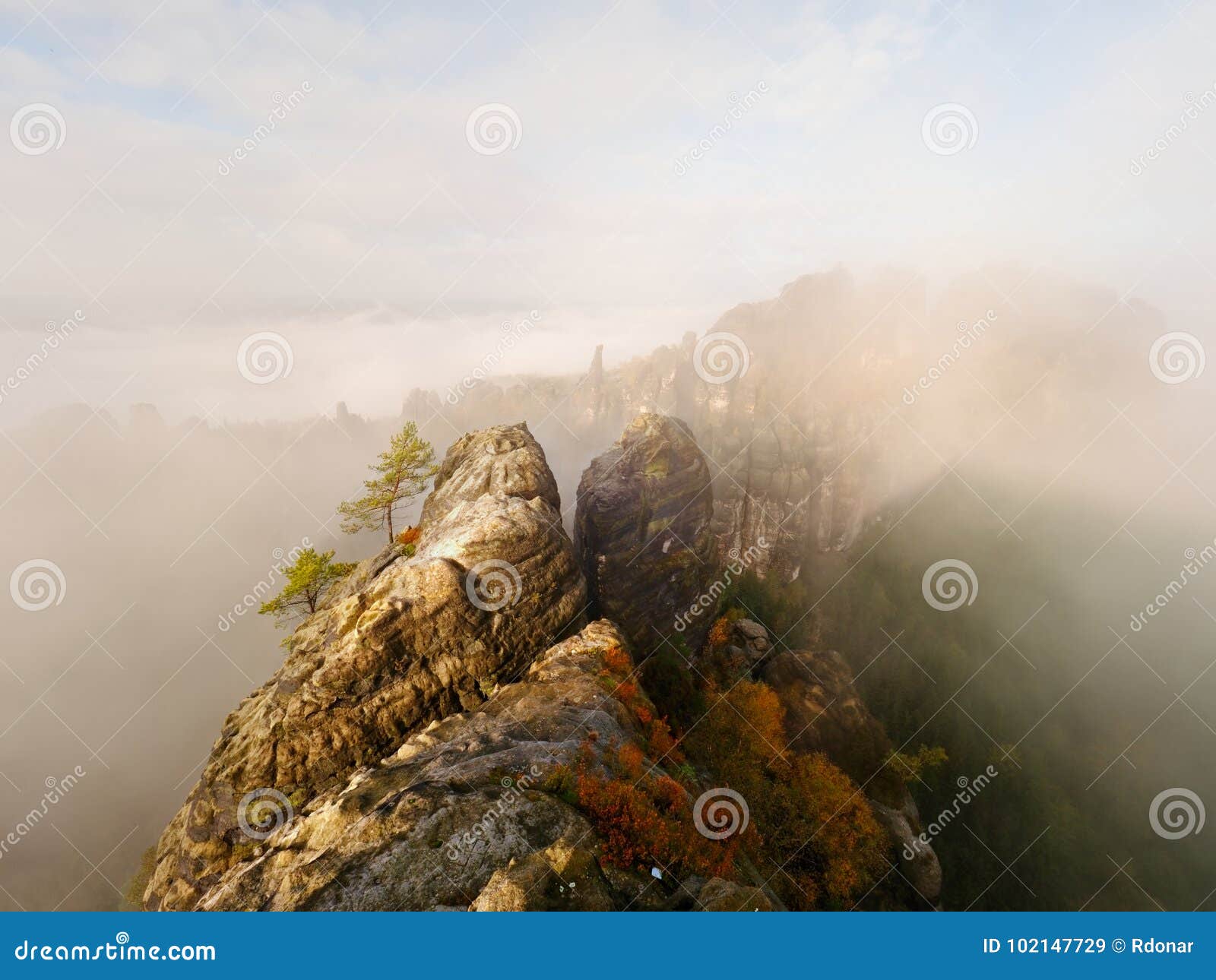 Distant Mountain Range and Heavy Clouds of Colorful Mist Above Deep ...