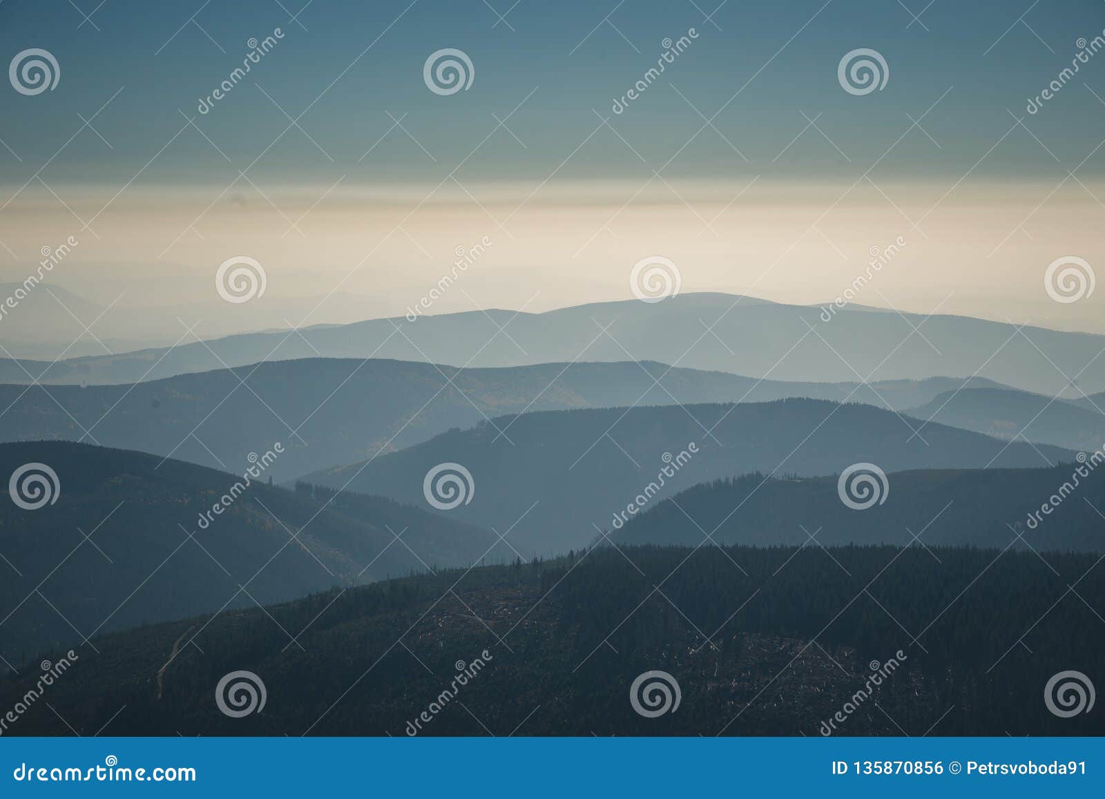 Distant Mountain Range and Thin Layer of Clouds on the Valleys. Stock ...