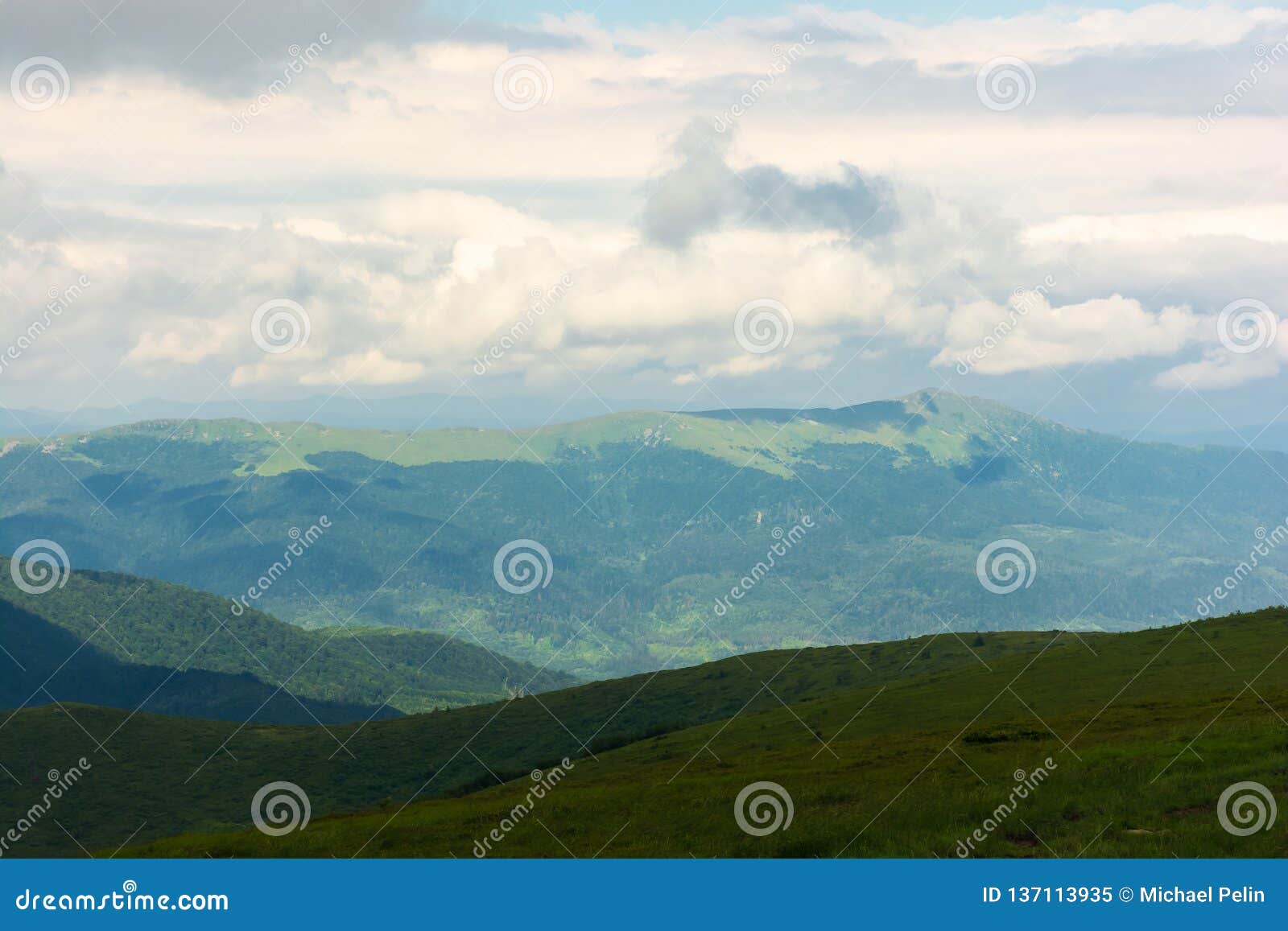 Distant Mountain Ridge in Clouds Stock Image - Image of divide, land ...
