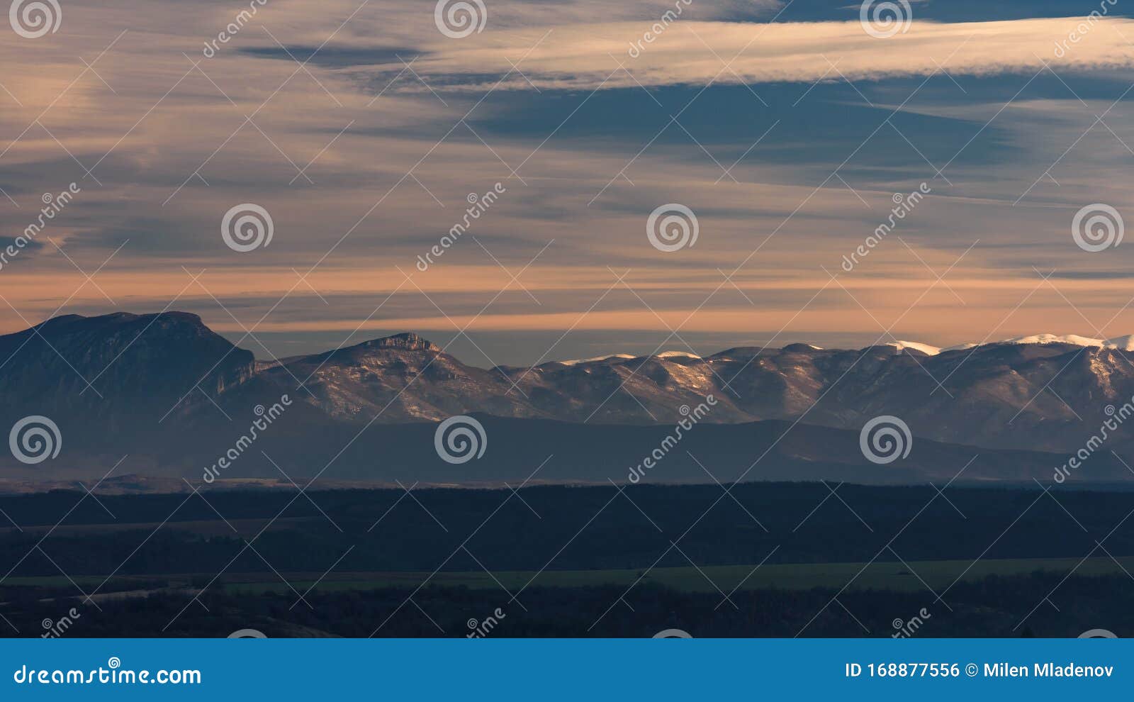 Distant Mountains at Sunset Stock Photo - Image of covered, valley ...