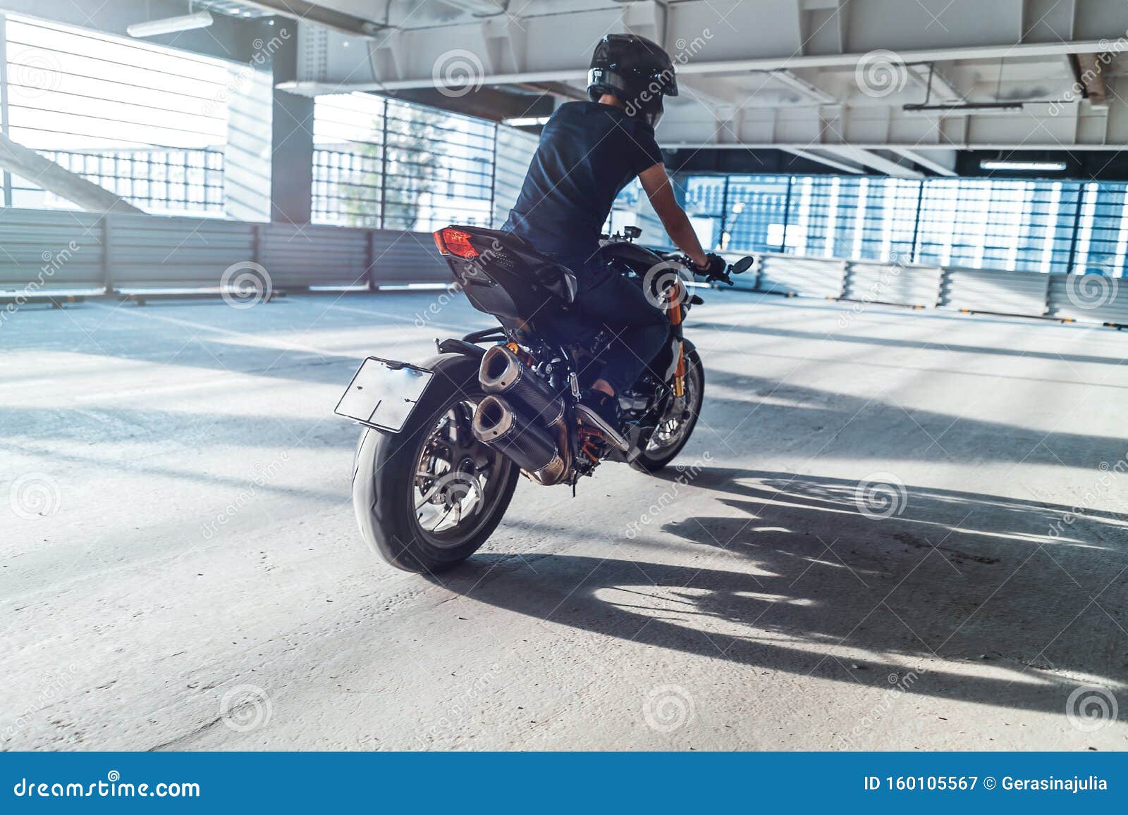 Distant Plan of Biker Riding Motorcycle at Parking. Urban Background ...