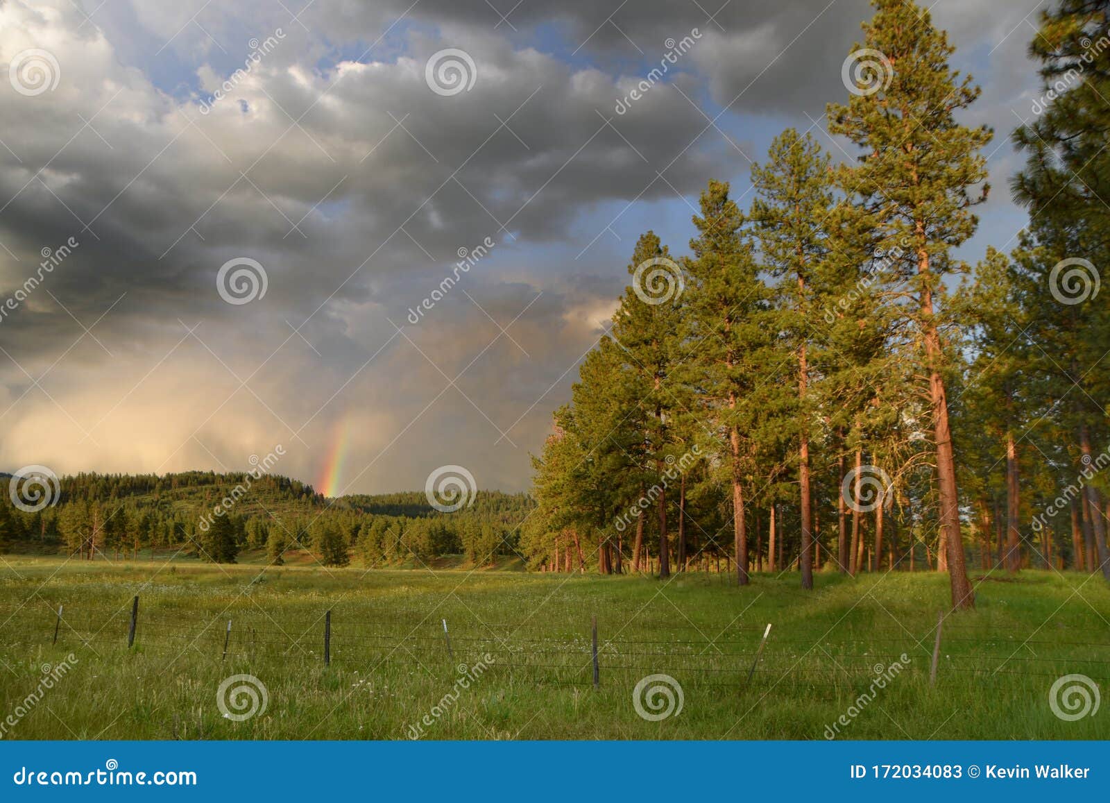 Distant Rainbow in the Breaking Clouds Stock Image - Image of field ...