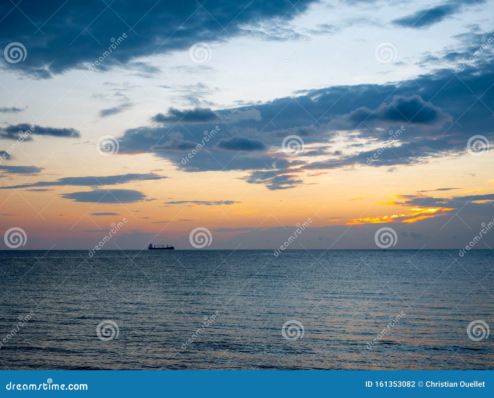 A Distant Ship in the Atlantic Ocean, Florida, during Sunset Stock ...