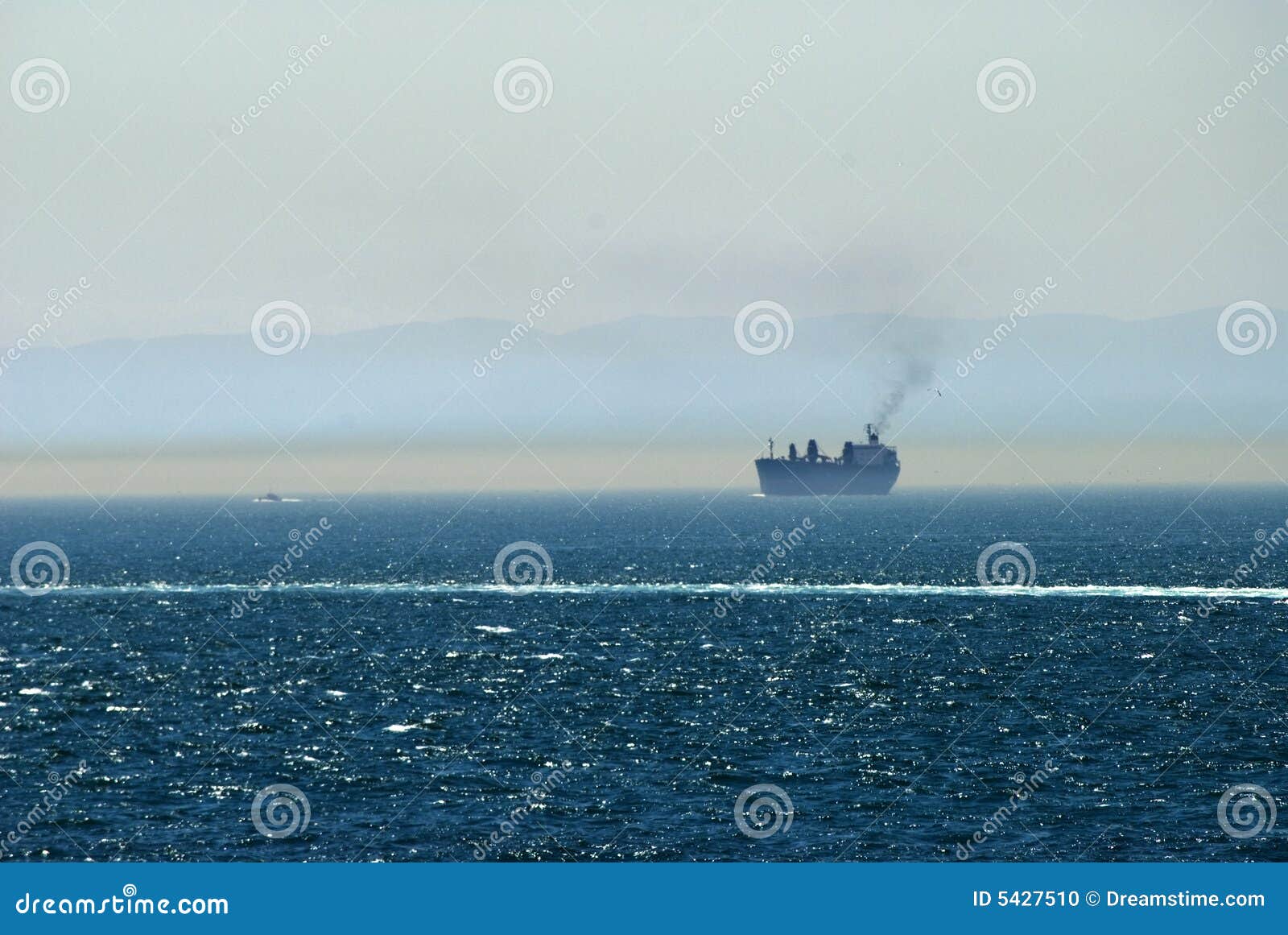 Distant Ship on Horizon with Smoke Stock Photo - Image of east ...