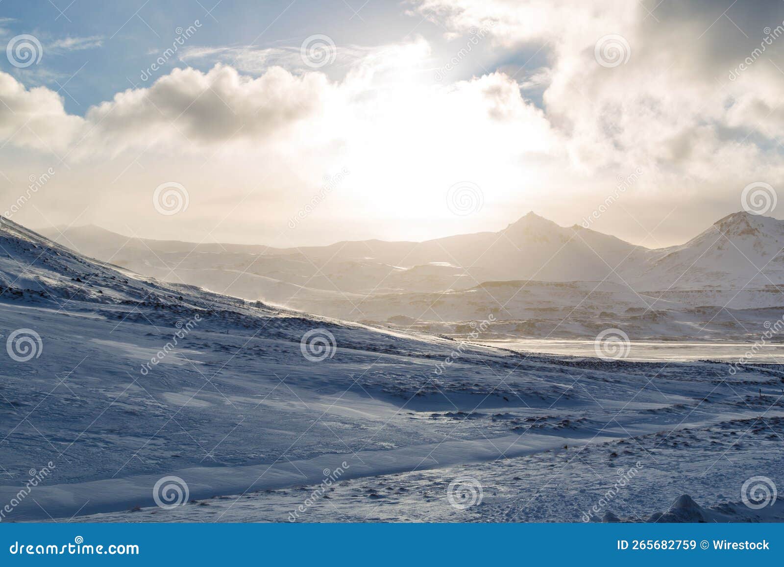 Distant Shot of Mountains and Fields Covered with Snow Under the ...