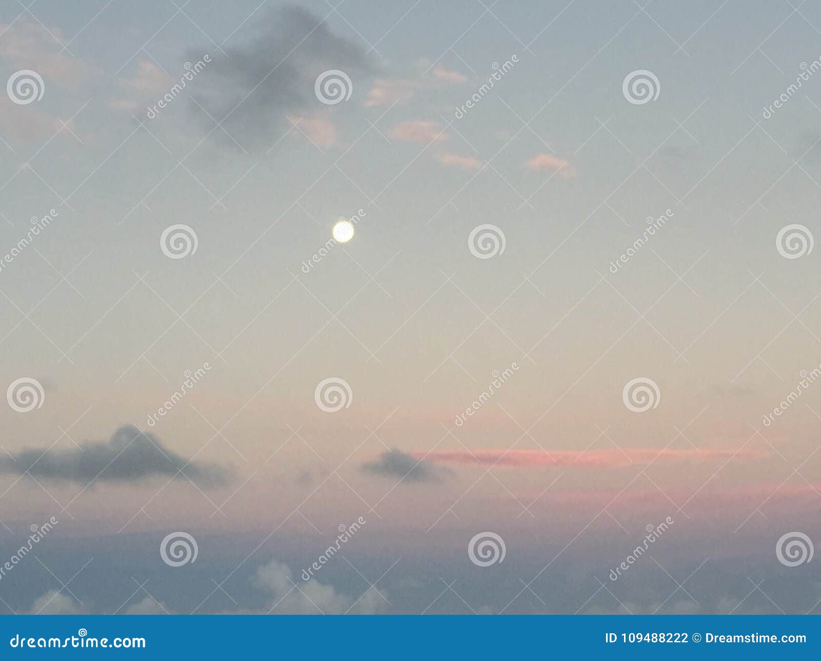 Distant Storm with Moon Already Rising at Dusk Stock Photo - Image of ...