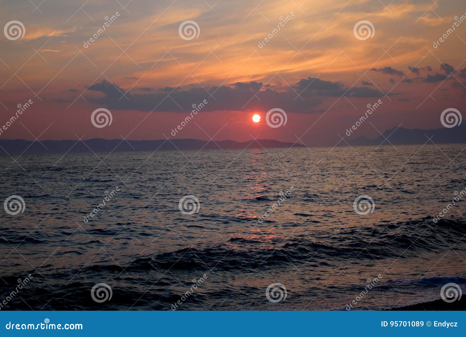Distant sunset over sea stock image. Image of relax, landscape - 95701089