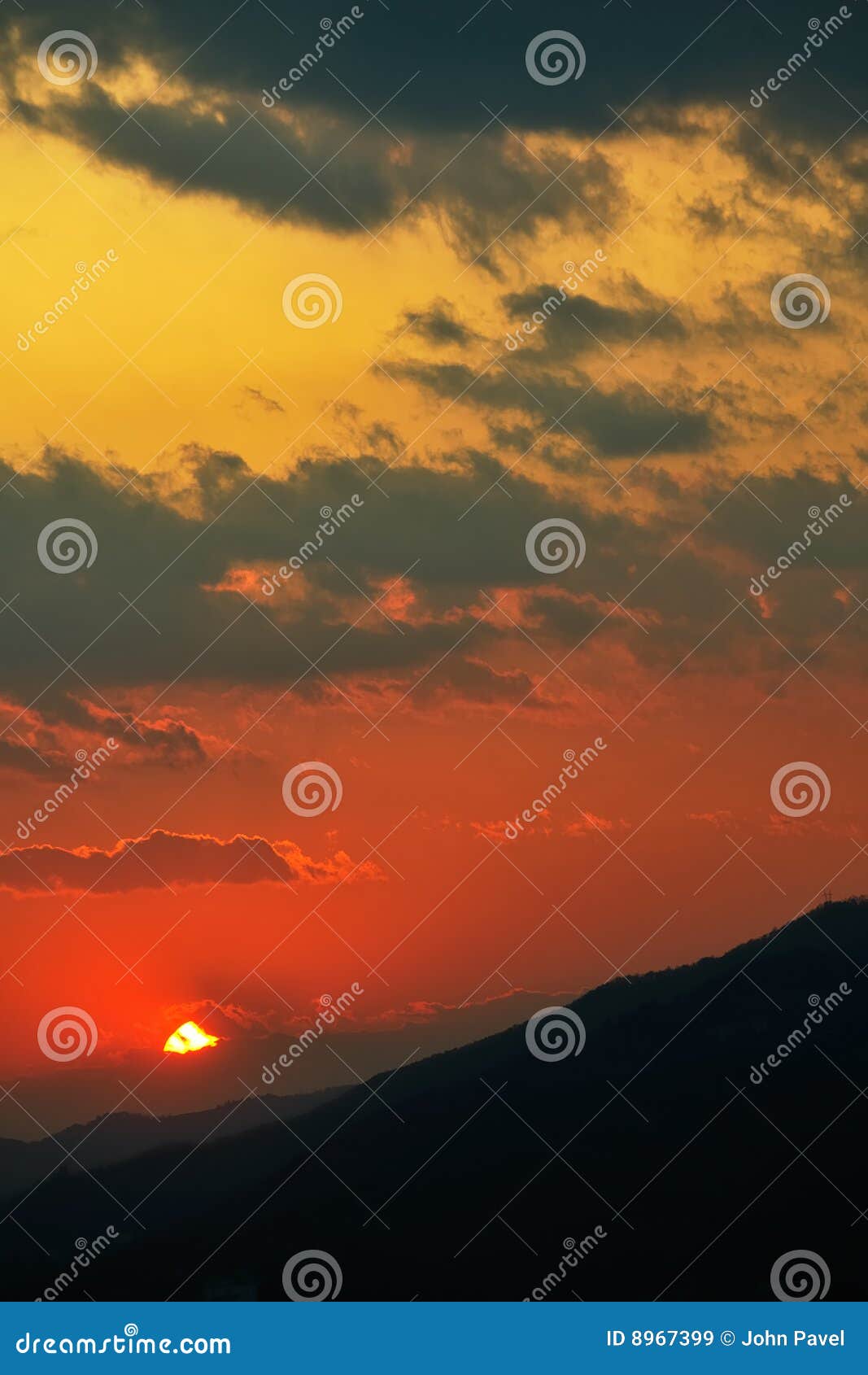 Distant Sunset Over Silhouettes of Crests of Hills Stock Image - Image ...