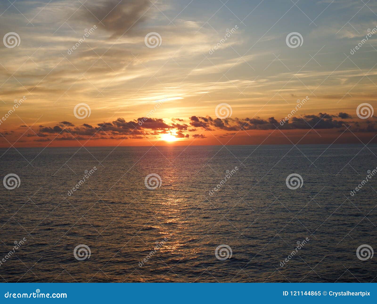 Distant Sunset Reflected on the Water Stock Image - Image of calm ...