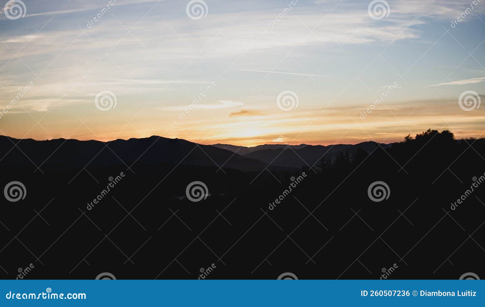 A distant sunset stock photo. Image of dawn, plain, sunrise - 260507236