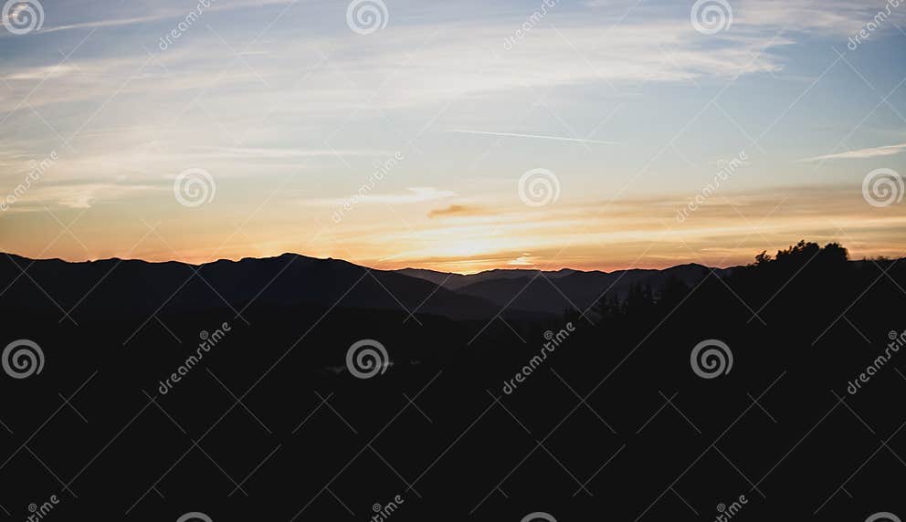 A distant sunset stock photo. Image of dawn, plain, sunrise - 260507236
