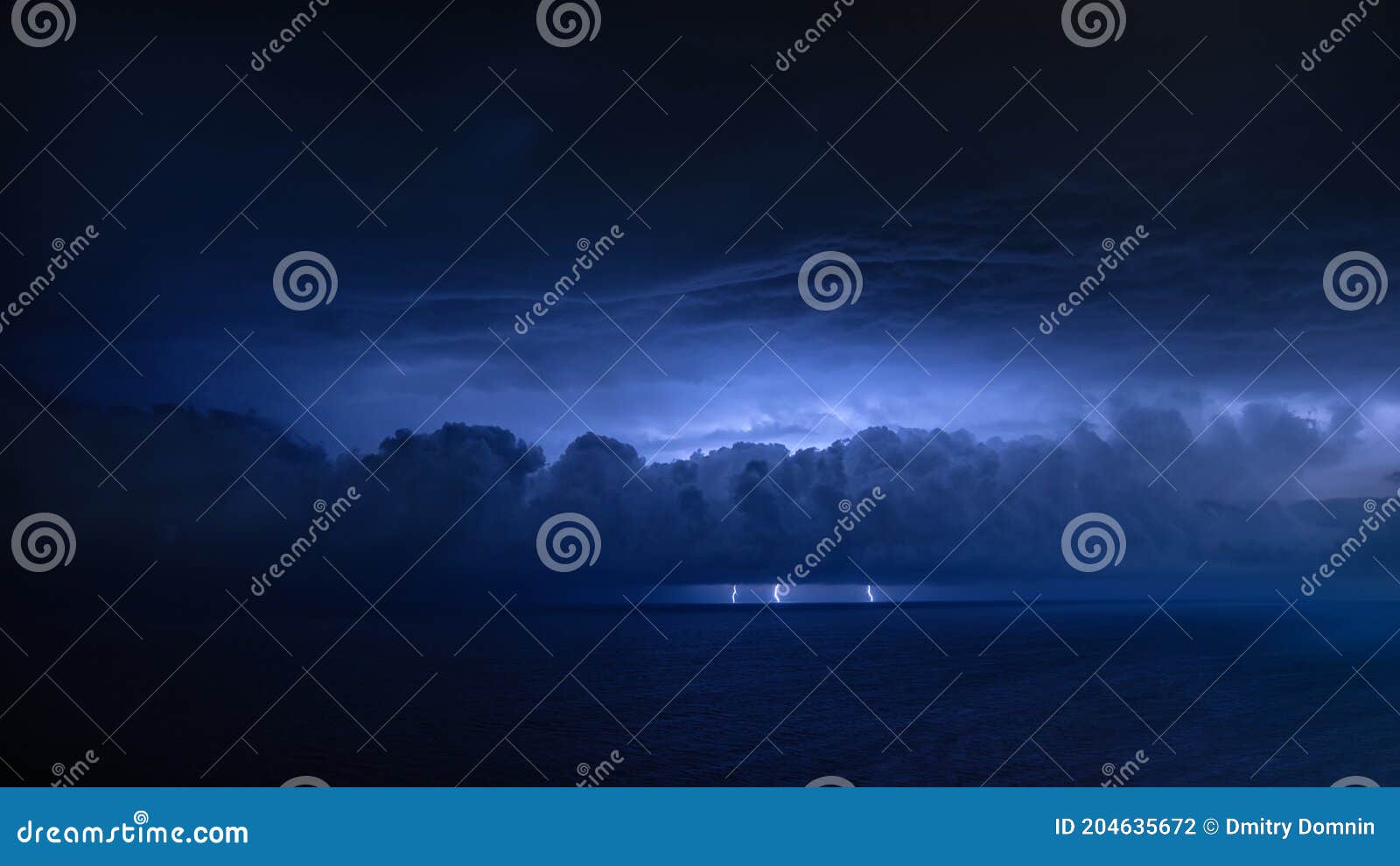A Distant Thunderstorm Front Over the Sea Stock Photo - Image of ...