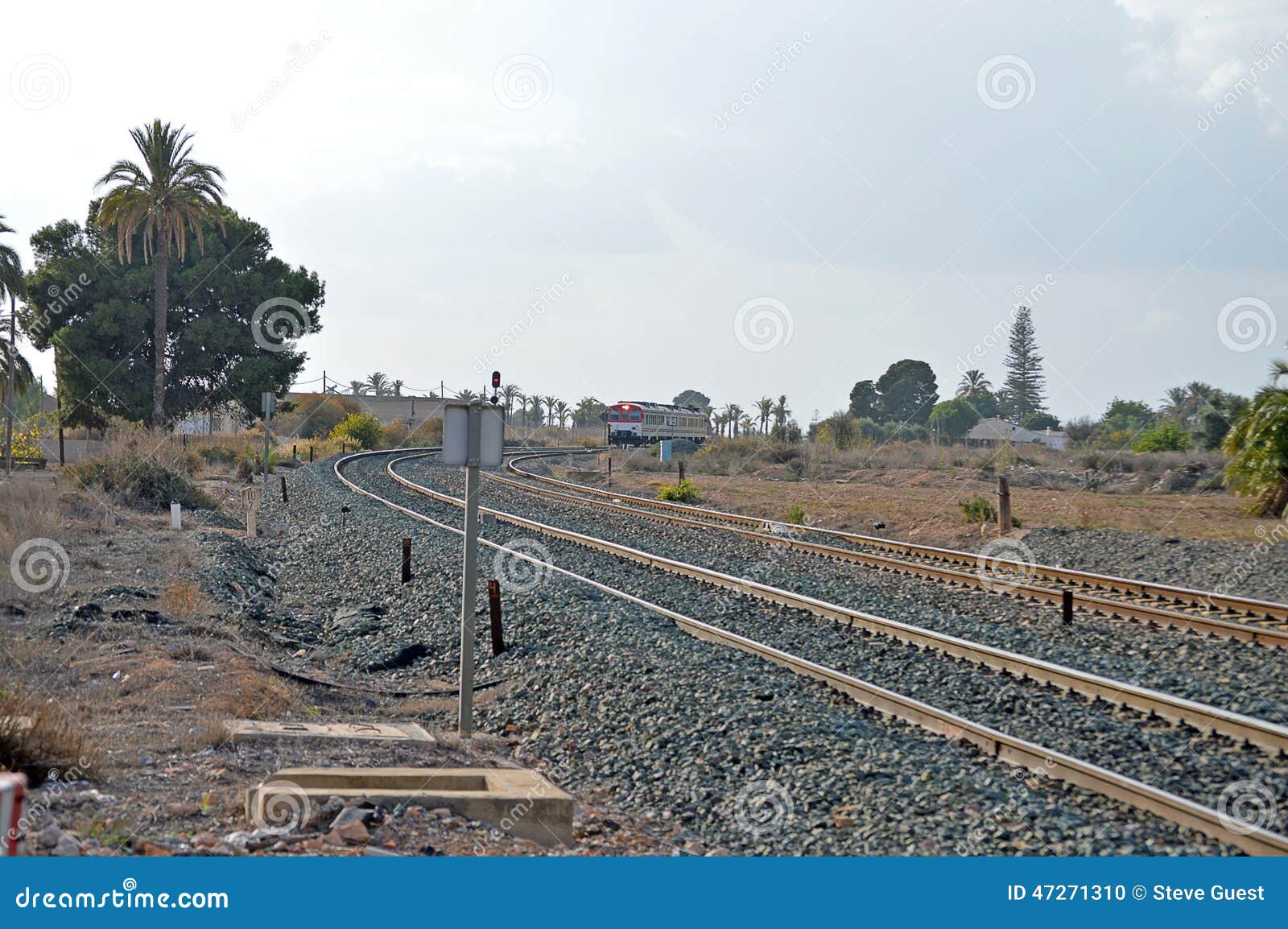 Railway Lines and a Distant Train on the Rail Track Stock Photo - Image ...