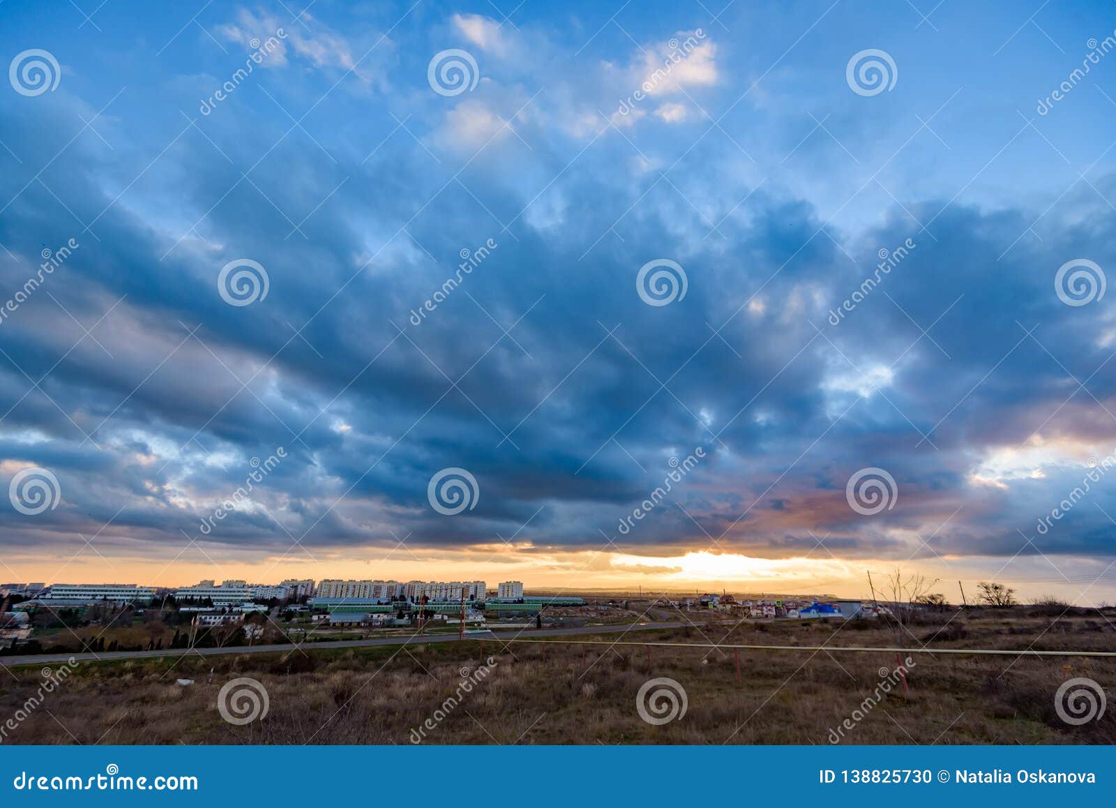 Distant View of City and Dramatic Skyscape with Clouds Stock Photo ...