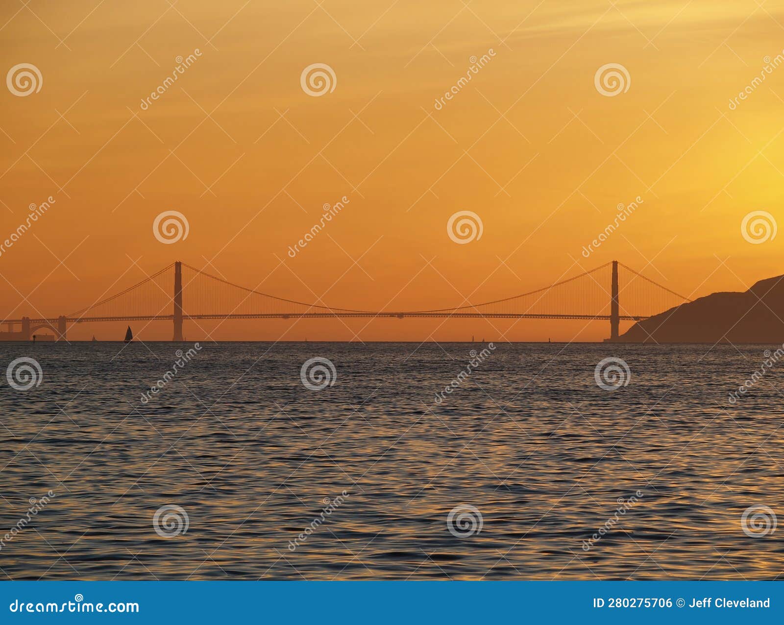Distant View of Golden Gate Bridge with Orange Sunset Sky Stock Photo ...