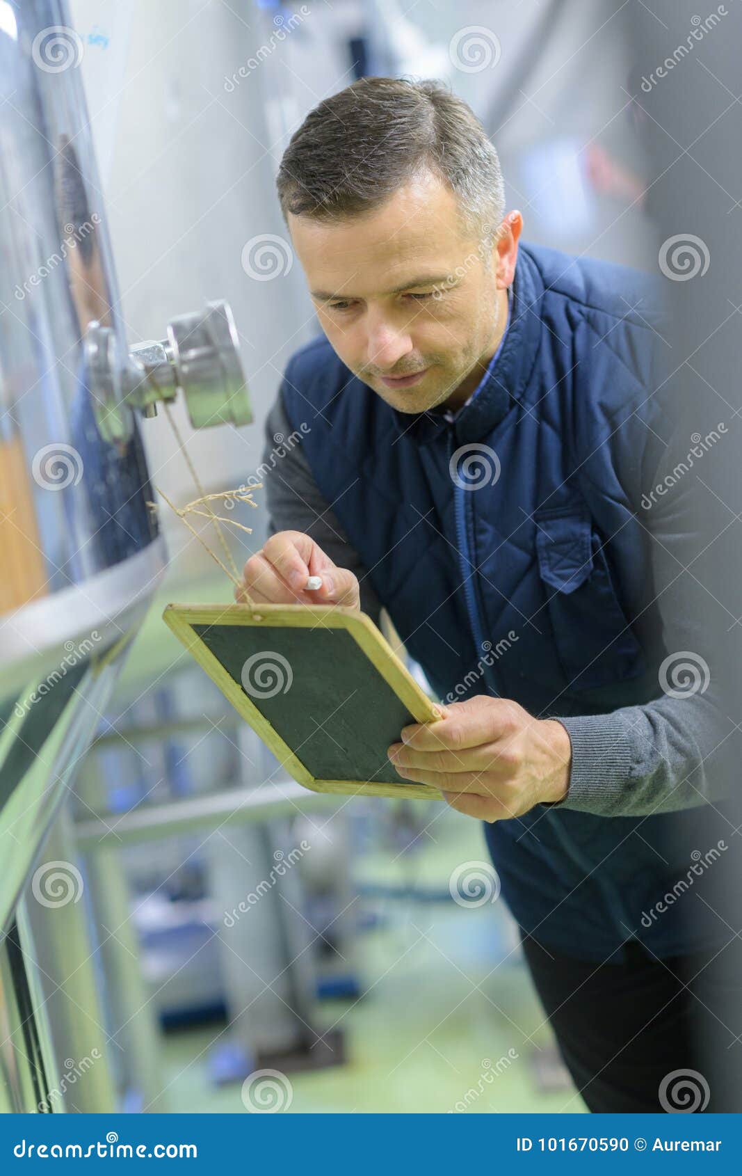Distillery Worker Writing Information on Board Stock Photo - Image of ...
