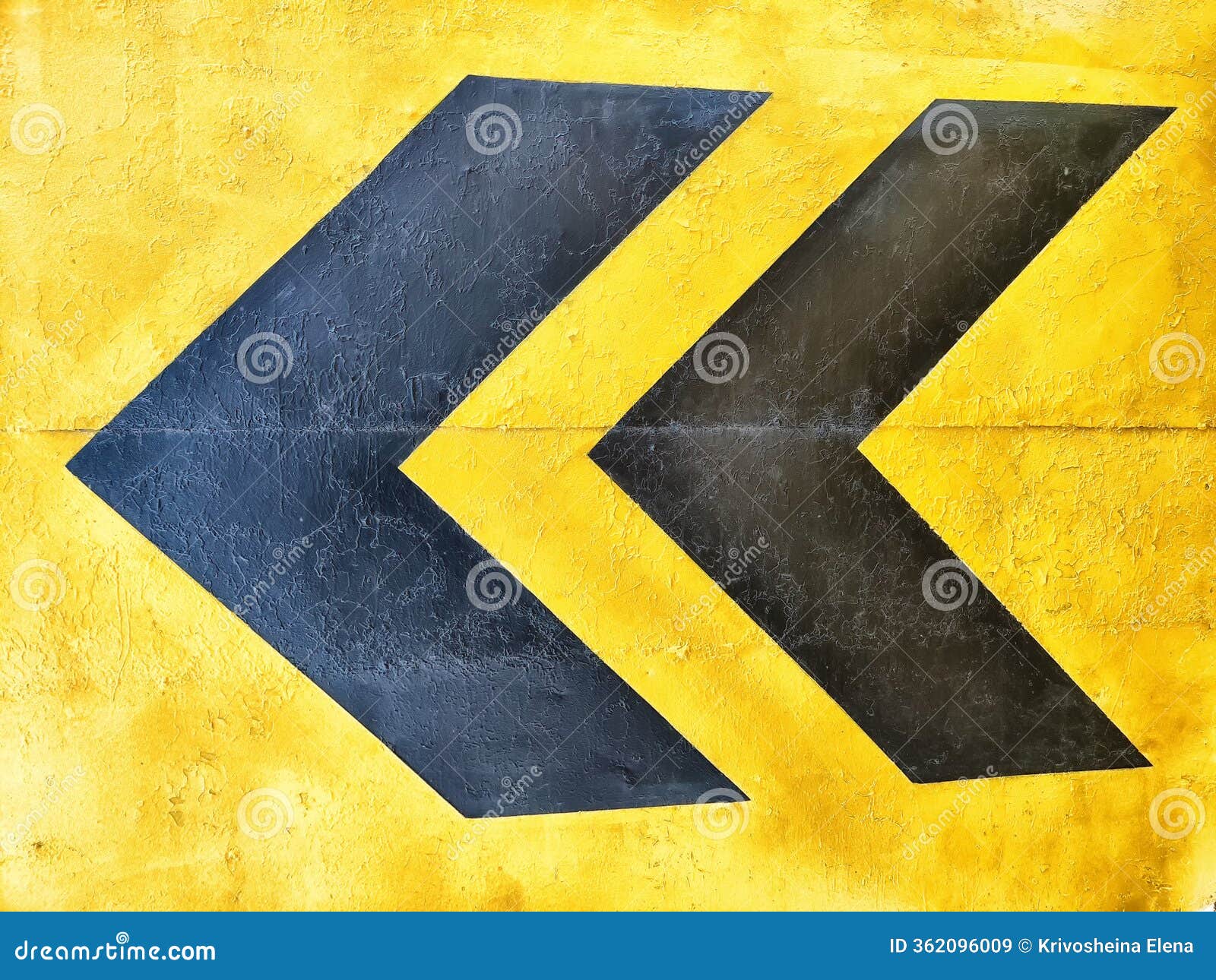 Distinctive Black and Yellow Directional Arrows on Textured Wall ...