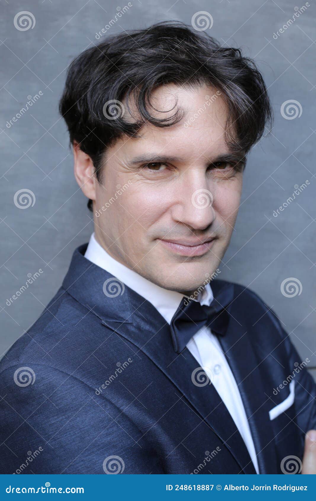 Distinguished Looking Man Wearing a Suit and a Bowtie Stock Image ...