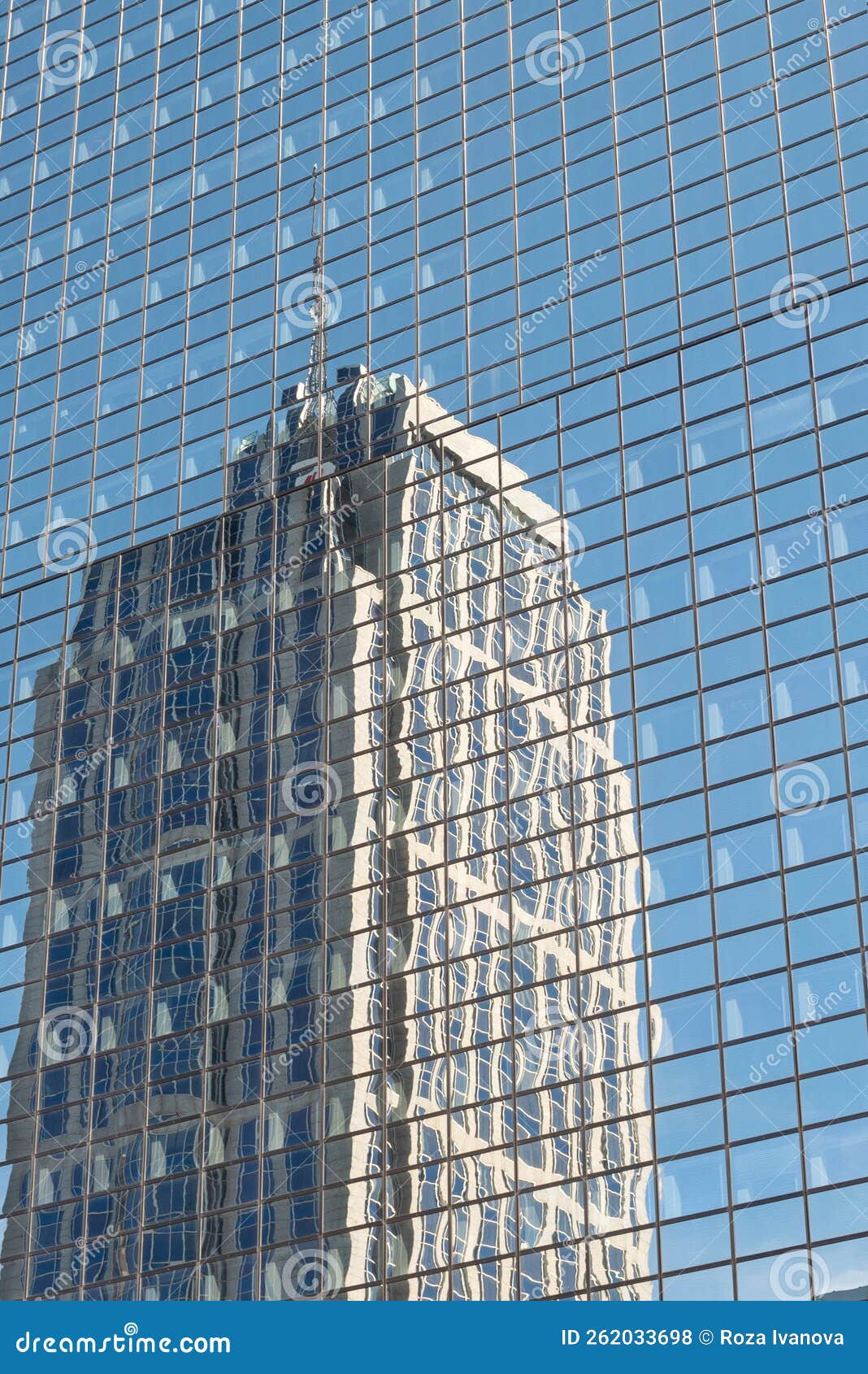 A Distorted Reflection of a Building in the Glazed Facade of Another ...