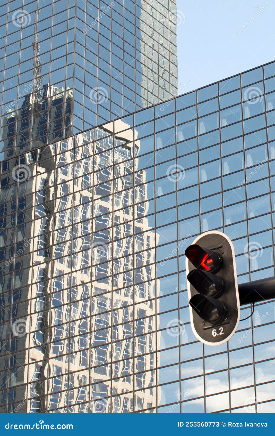 A Distorted Reflection of a Building in the Glazed Facade of Another ...