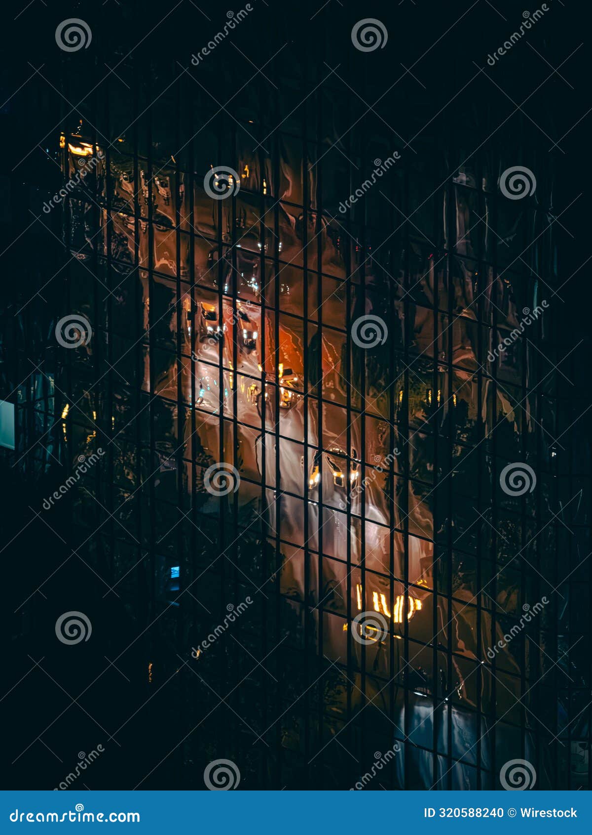 Distorted Reflection of Cars on the Skyscraper Facade at Night Stock ...