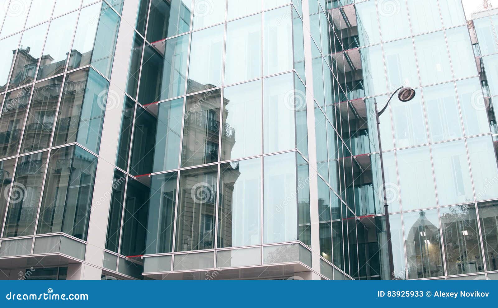 Distorted Reflection of Old Building in Modern Office Glass Facade in ...