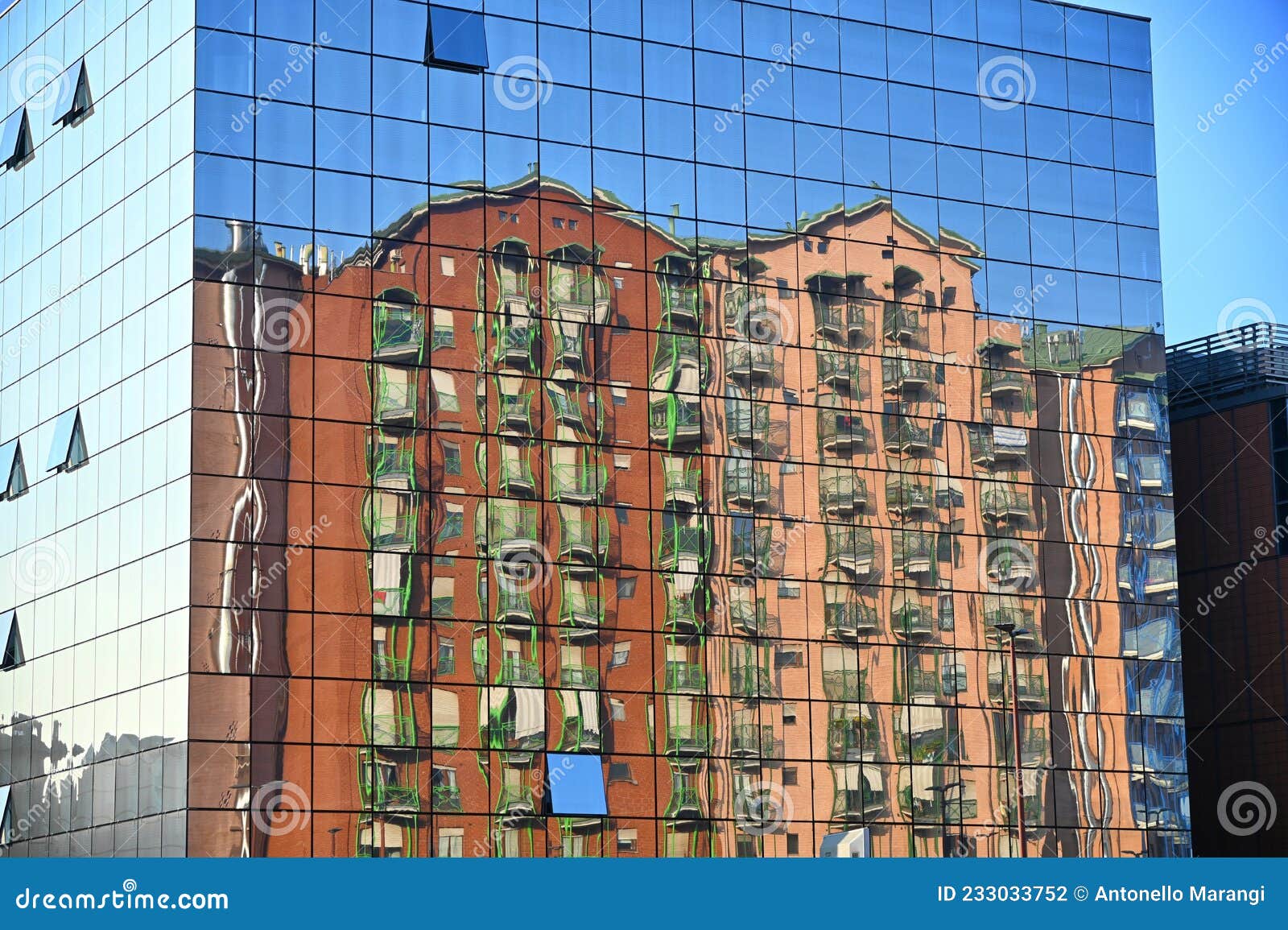 Distorted Reflection of Residential Buildings in the Glass Reflective ...