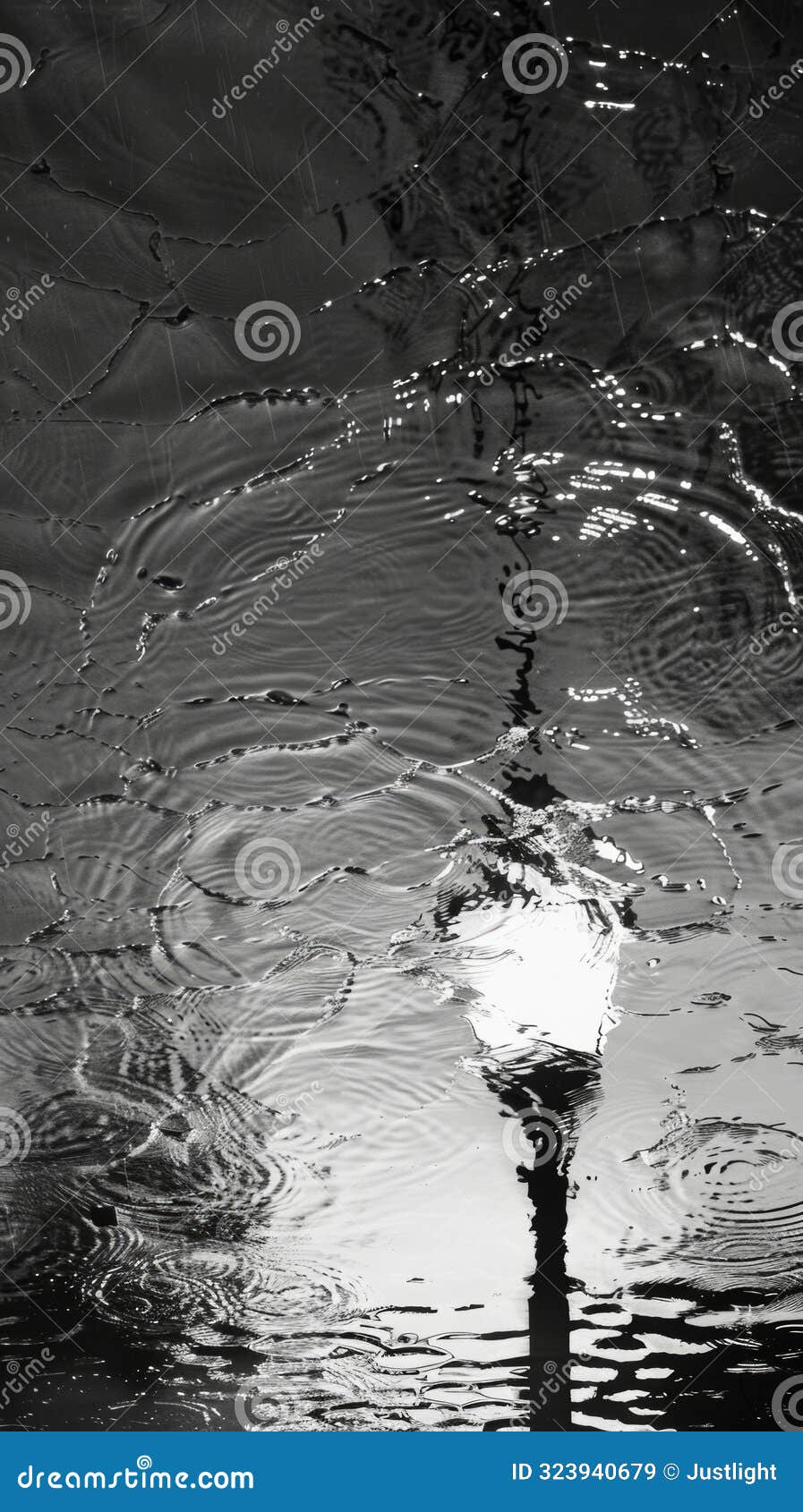 The Distorted Reflection of a Street Lamp on a Rainy Night Forming an ...