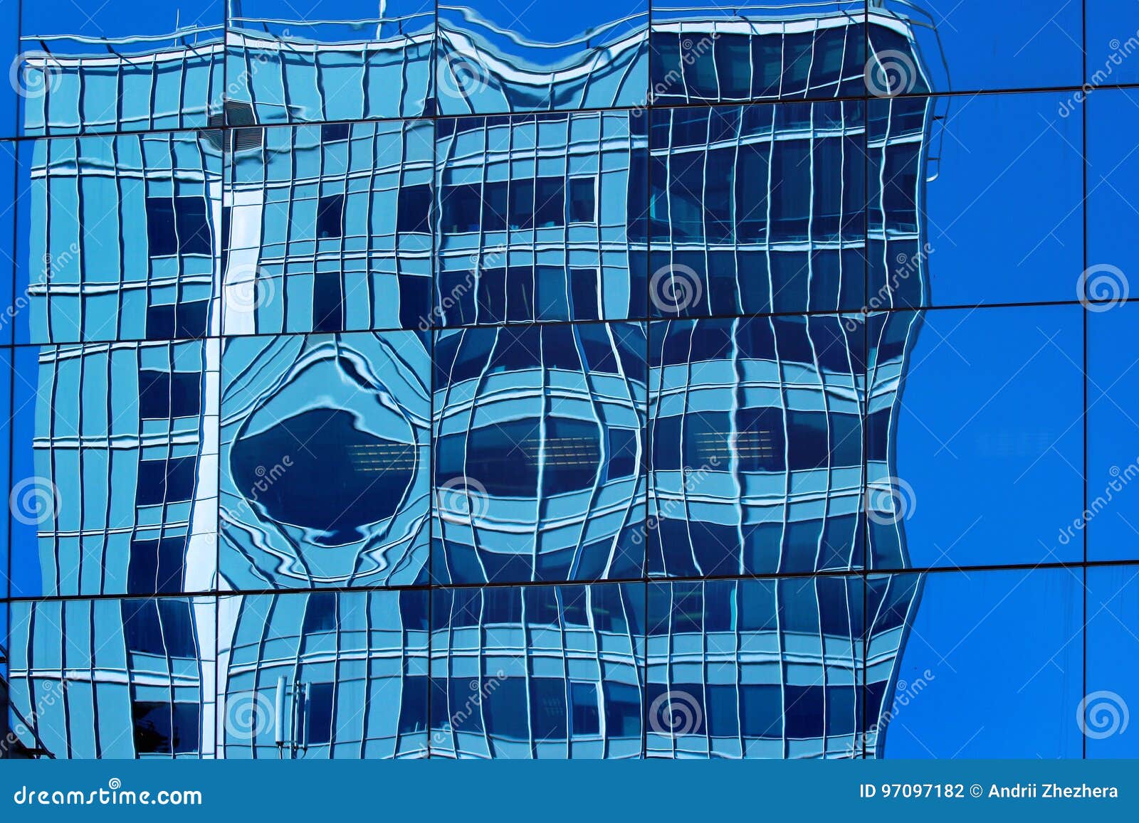 Distorted Reflection in a Wall of Glass Office Building Stock Photo ...