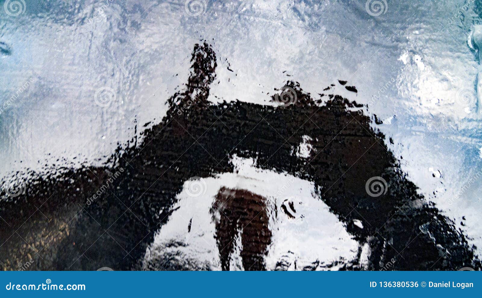 Distorted Reflection from Wet Pavement Stock Photo - Image of ...