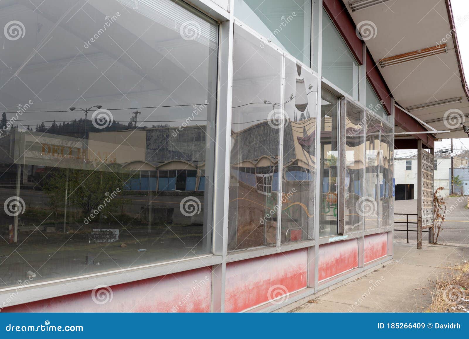 Distorted Reflections Of Skyscrapers In The Glass Facade Of A Modern ...