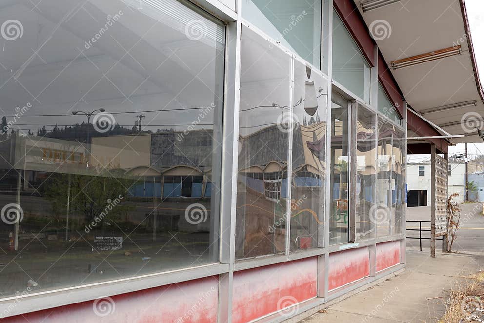 Distorted Reflections in the Windows of an Abandoned Grocery Store ...