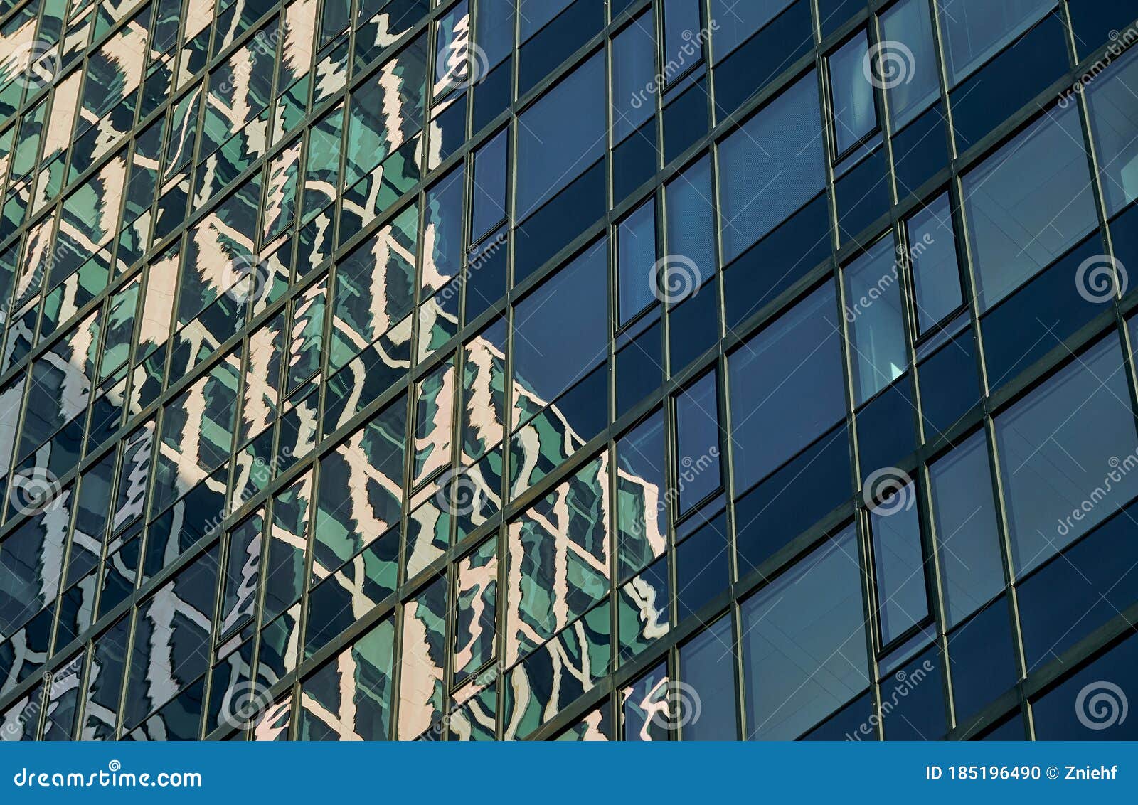 Distorted And Shifted Reflection Of The Facade Of A Skyscraper In A ...